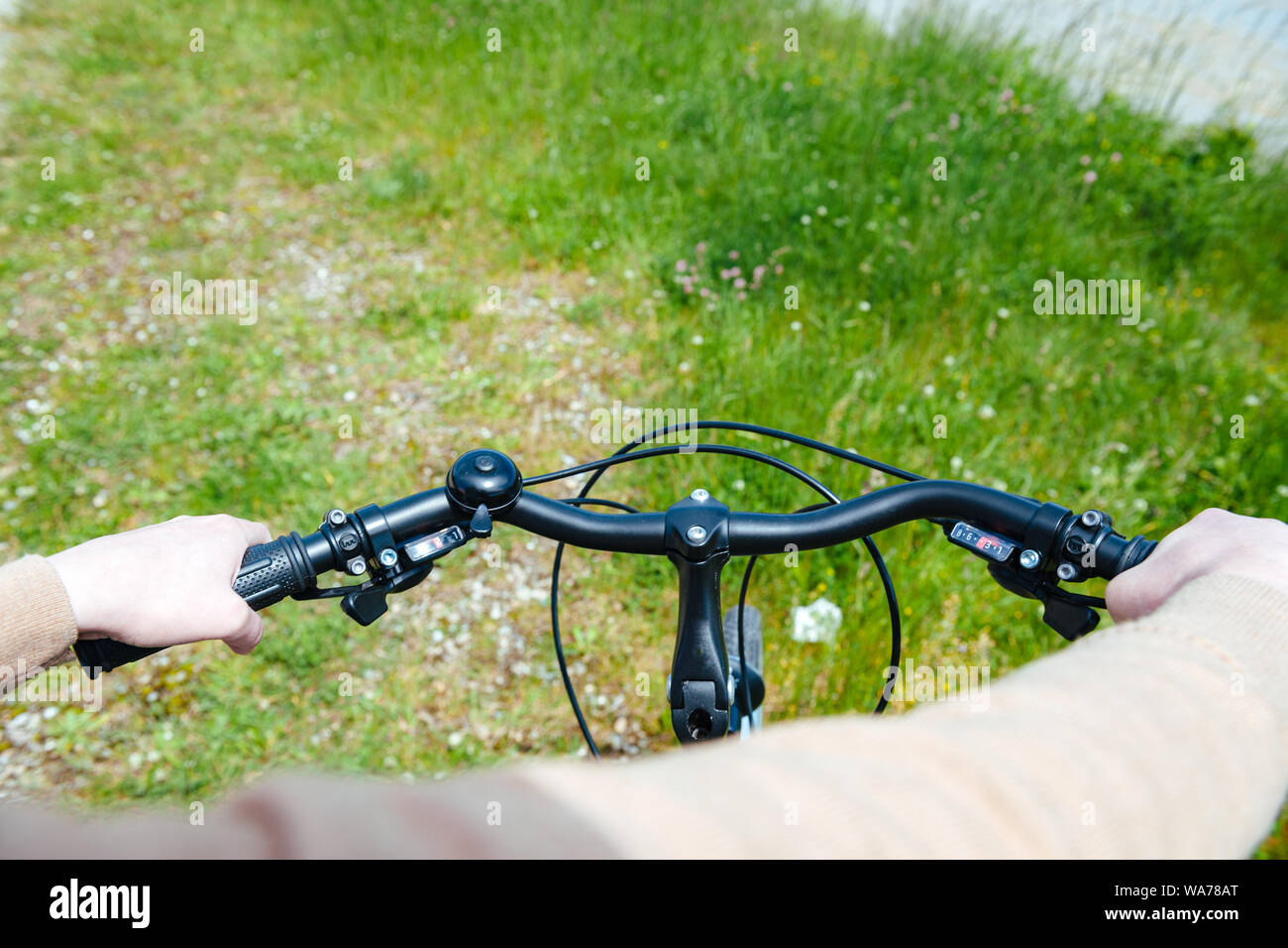POV of cyclist hand holding bicycle handle with multiple speeds and ...