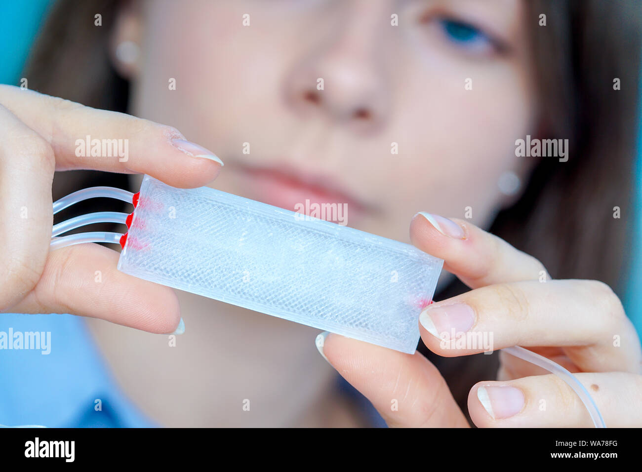 Girl holding polymers Bio-MEMS biomedical microelectromechanical ...