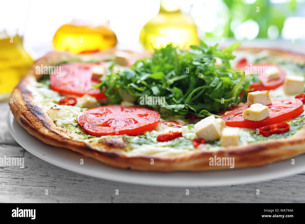 Italian cuisine. Italian pizza with additions of fresh vegetables Stock ...