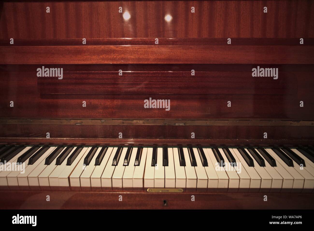 Shot of a brown piano Stock Photo - Alamy