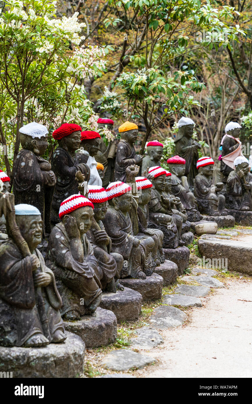 Japan, Miyajima. Small Rakan statues of Buddhist monks, disciples of ...