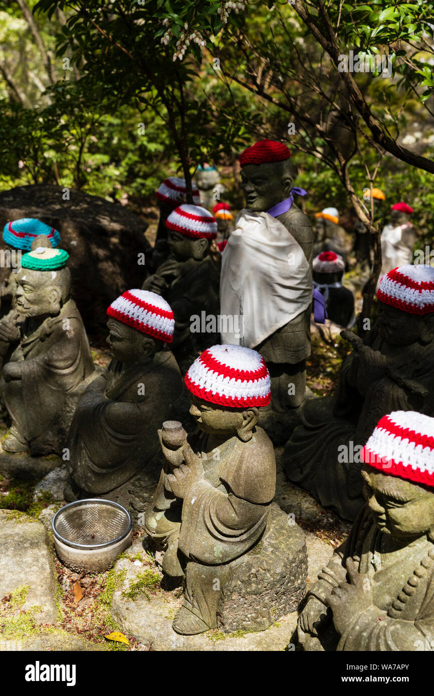 Japan, Miyajima. Small Rakan statues of Buddhist monks, disciples of ...