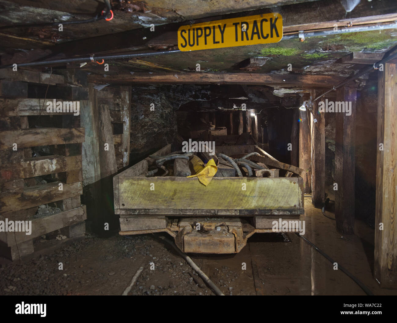 An old rail flat car loaded with mining equipment within 1,500 feet of ...
