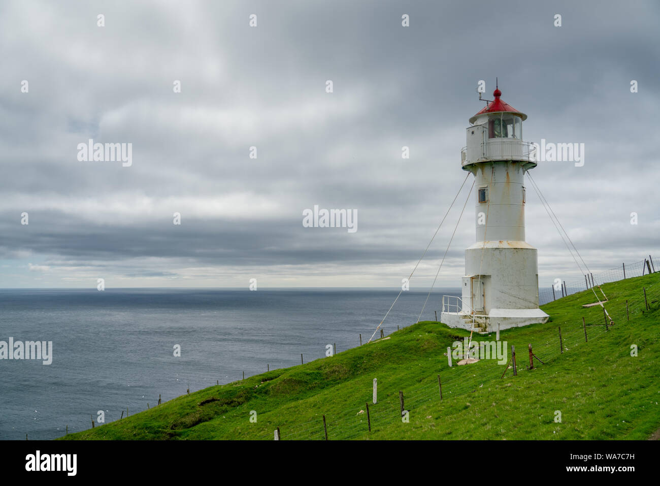 The lighthouse on Mykines island, Faroe Islands Stock Photo - Alamy