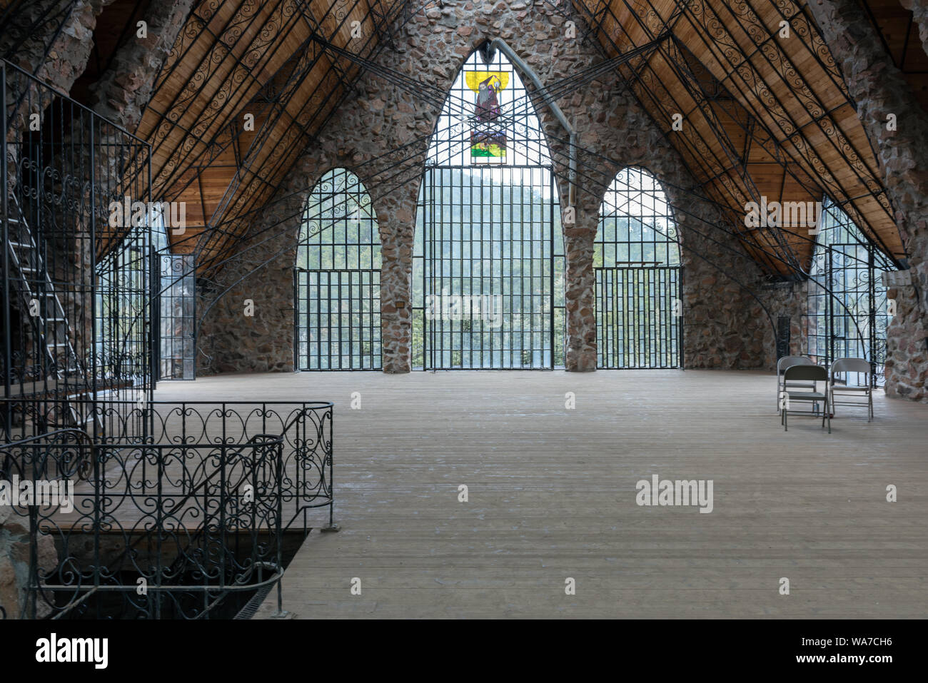 Arched windows with a mountain view inside Bishop's Castle, a most ...