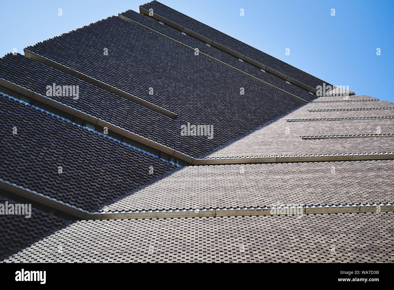 London, UK - August, 2019. Detail of the brickwork facade of the Switch ...