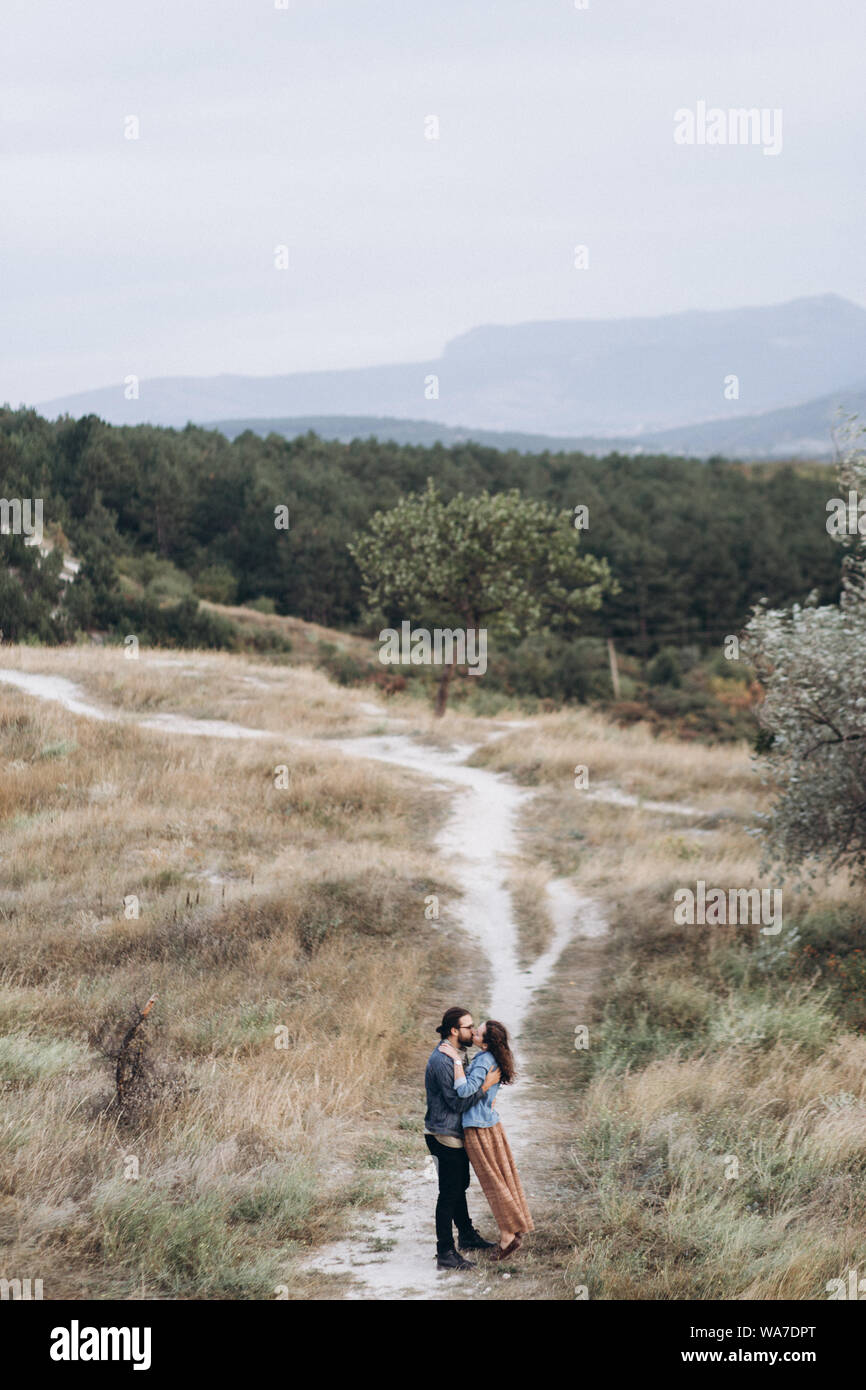 Boyfriend and Girlfriend run in tall yellow grass in the forest Stock ...