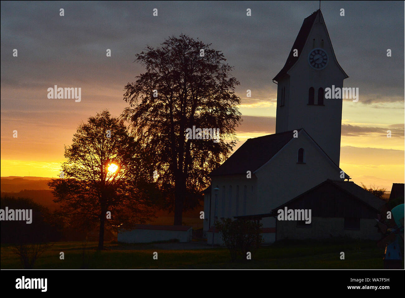 Beautiful sunrise behind church hi-res stock photography and images - Alamy