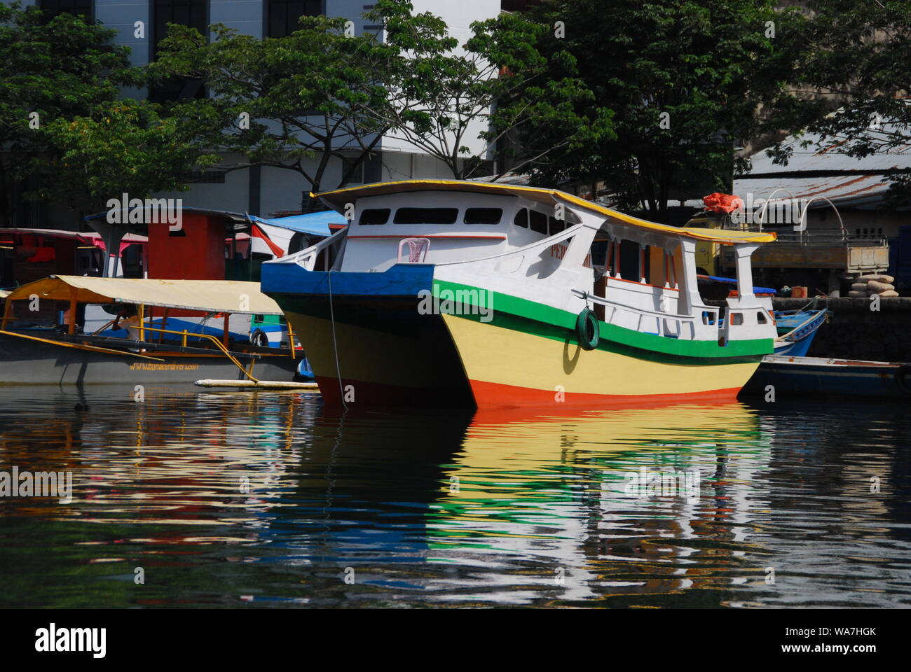 A small colourful boat in the Port of Manado, North Sulawesi in ...