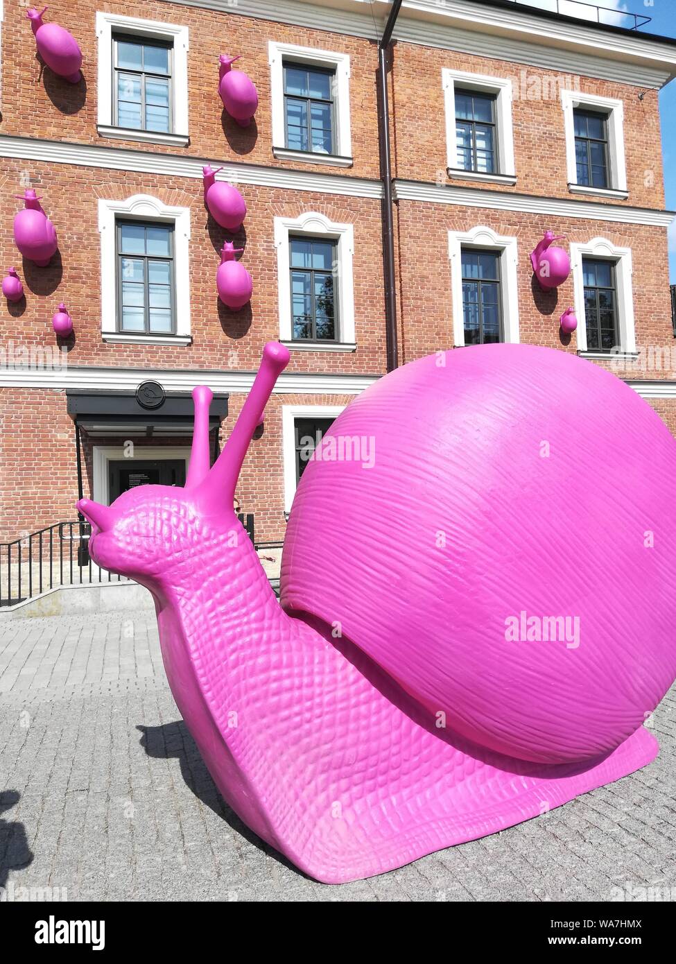 Pink snails installation, made from recycled plastic by eco-activists ...