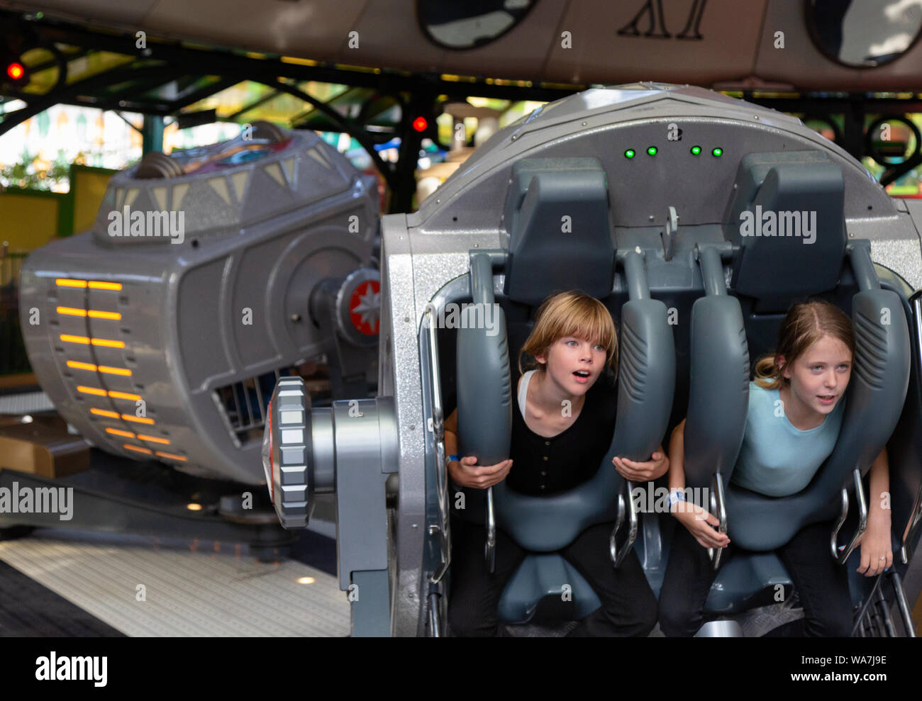 Fairground children; kids having fun on a fairground ride; Tivoli ...