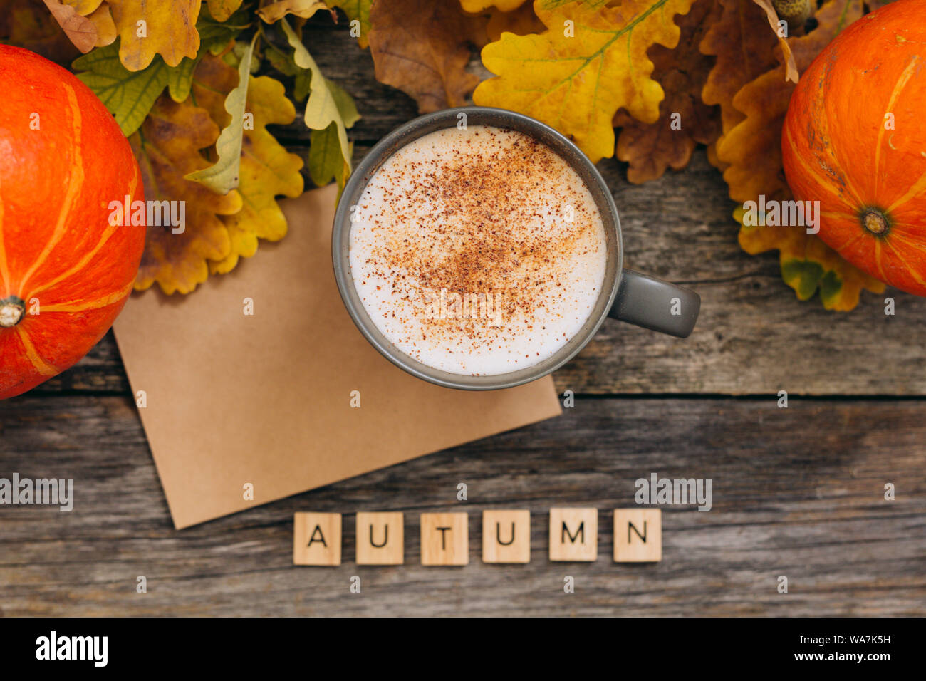Autumn flatlay composition with letter, craft envelope, coffee latter ...