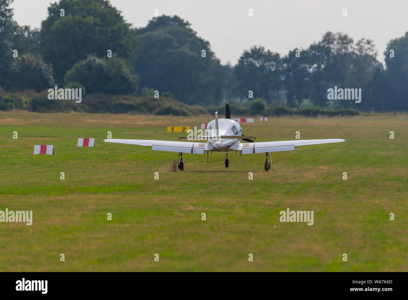 a landing plane on a small airfield Stock Photo - Alamy