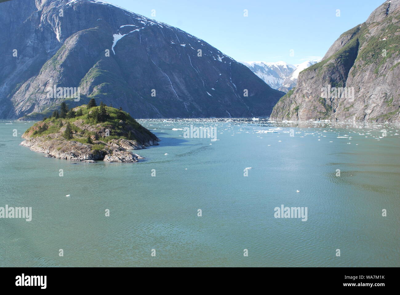 Island surrounded by glaciers and mountains Stock Photo - Alamy