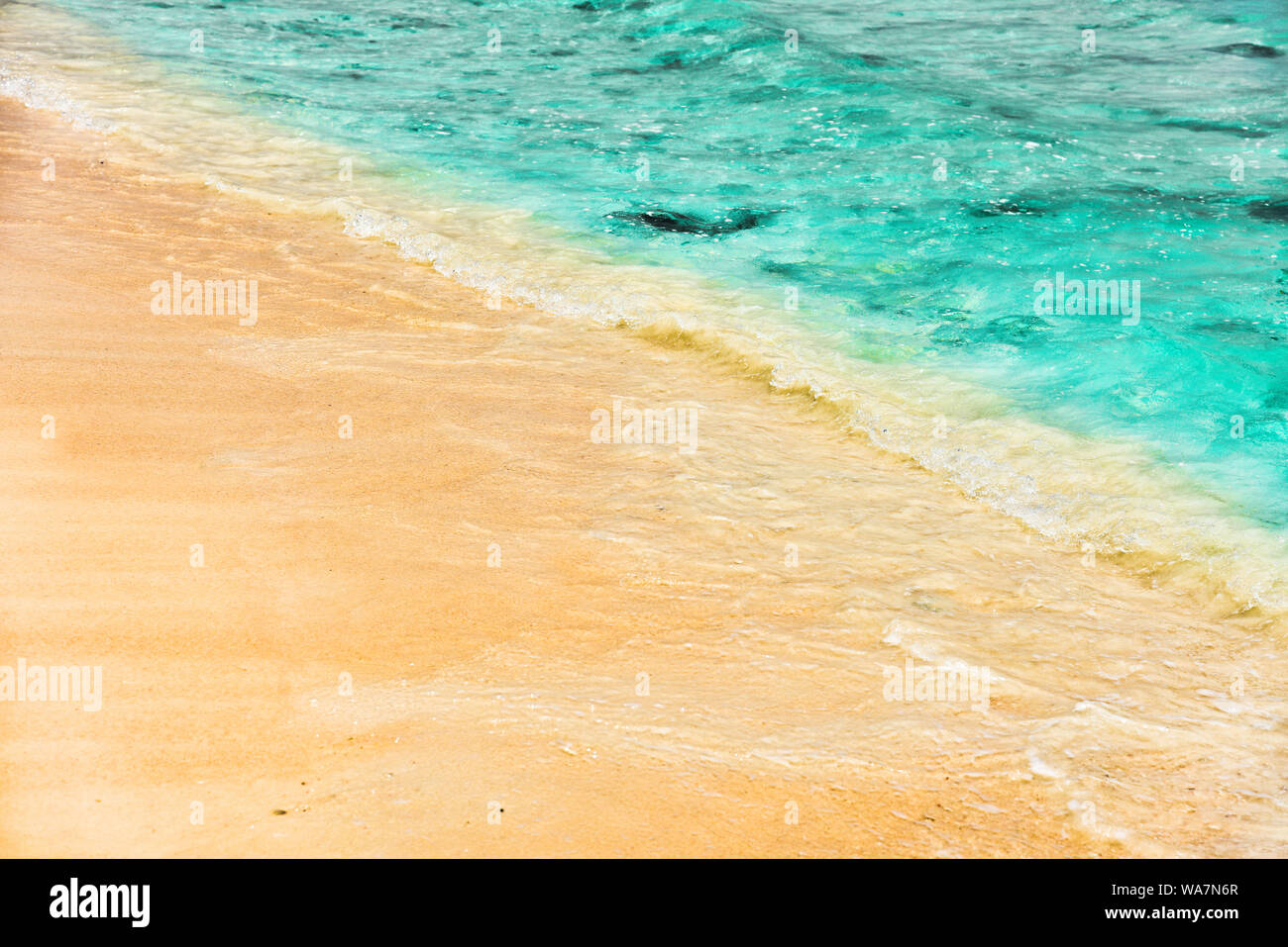 Tropical beach blue ocean wave and bubble. Soft beautiful sea water and ...
