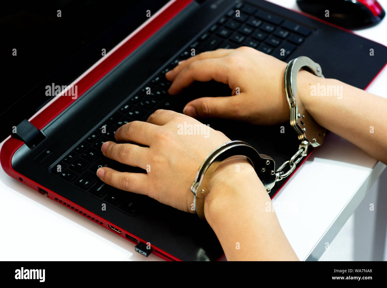 Cyber Crime Concept. Handcuffs on Laptop Computer Stock Photo - Alamy
