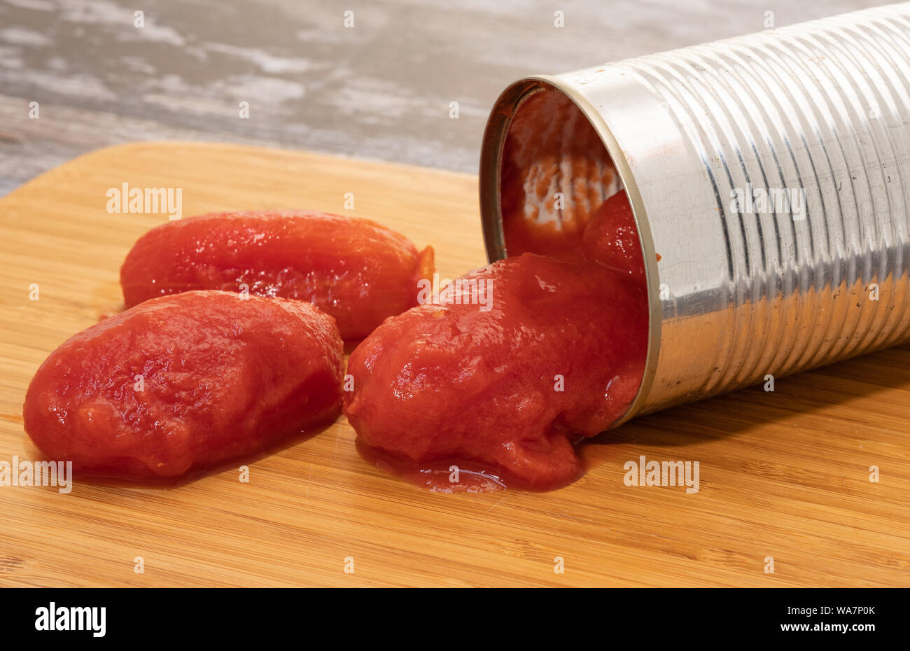 An open can of tomatoes Stock Photo - Alamy