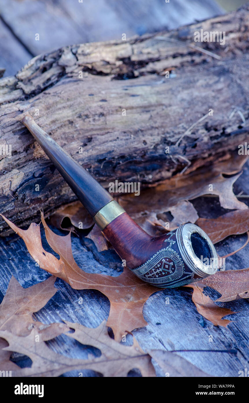 antique inlaid pipe resting in leaves on a crisp fall day Stock Photo ...