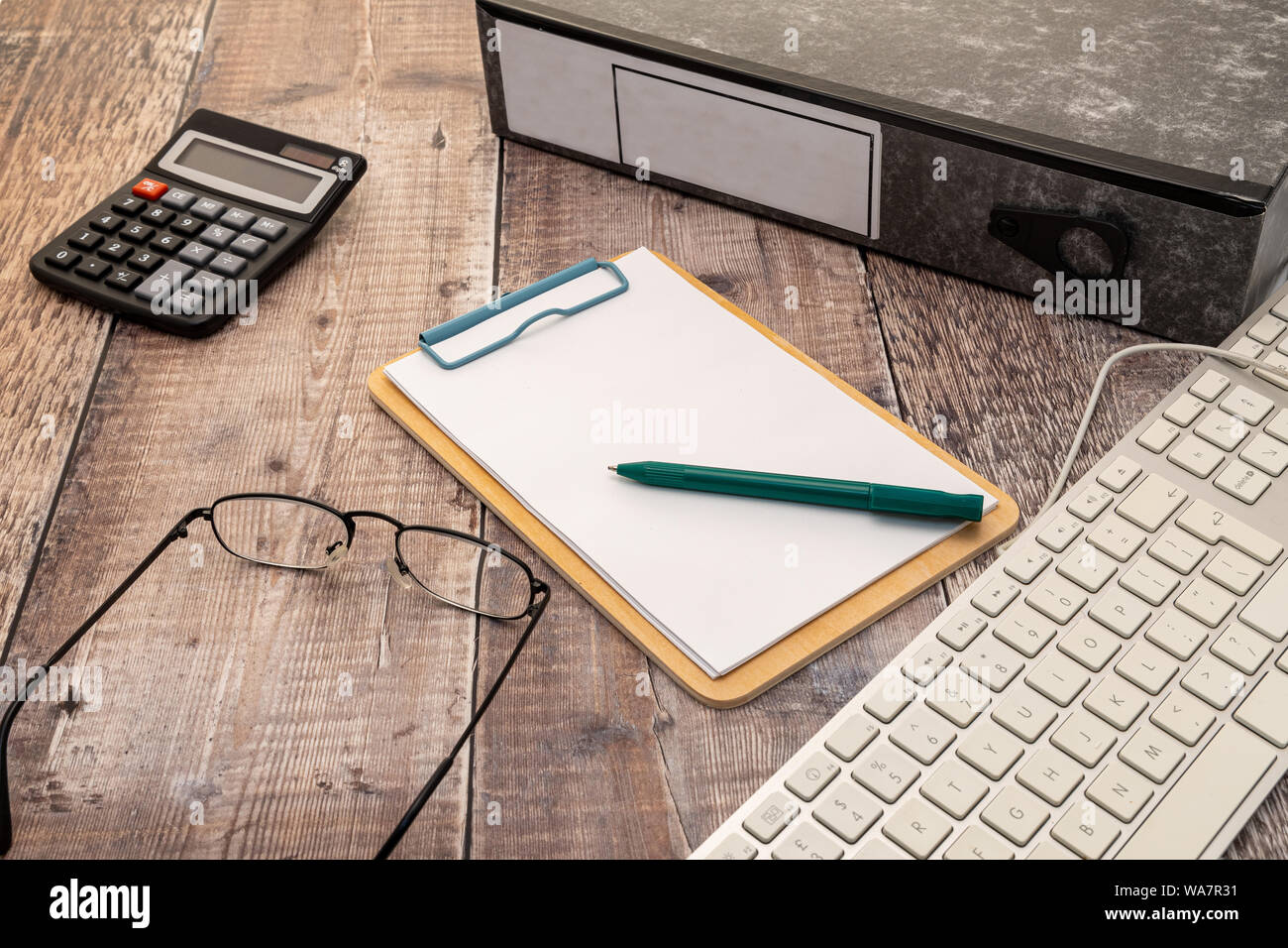 A workplace desk with items of equipment Stock Photo - Alamy
