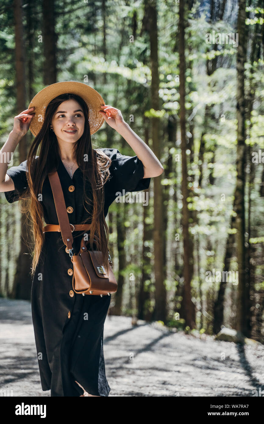Carefree european girl in attire at the park. Outdoor portrait of young ...