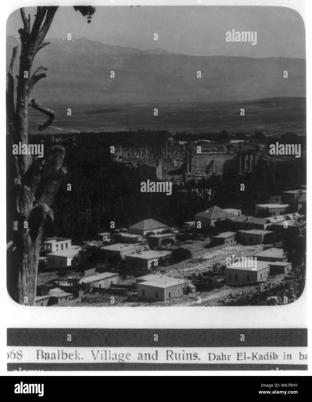 Baalbek - Village and ruins - Dar El-Kadib in background Stock Photo ...