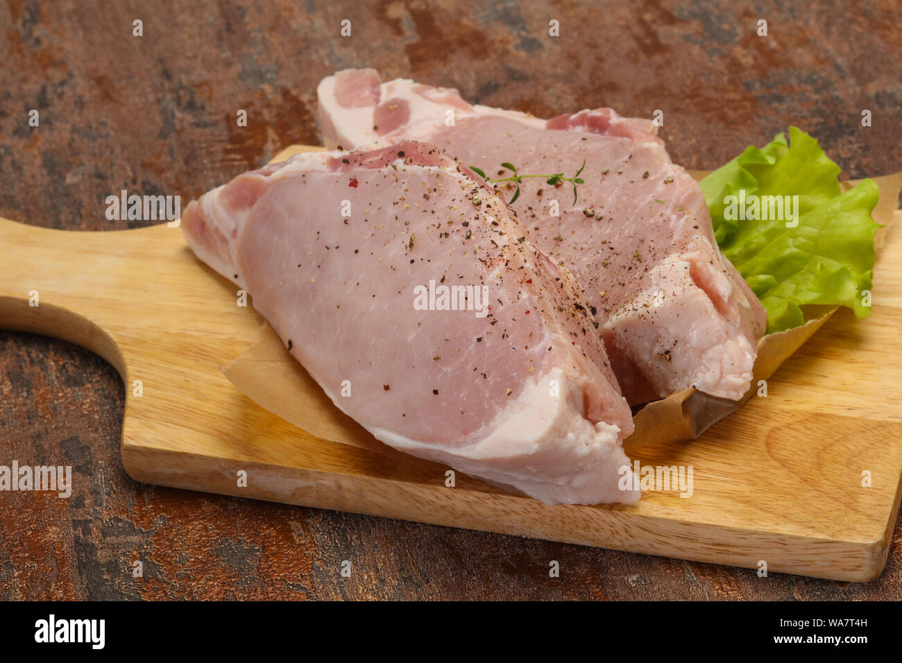 Raw pork meat steak ready for grill Stock Photo - Alamy