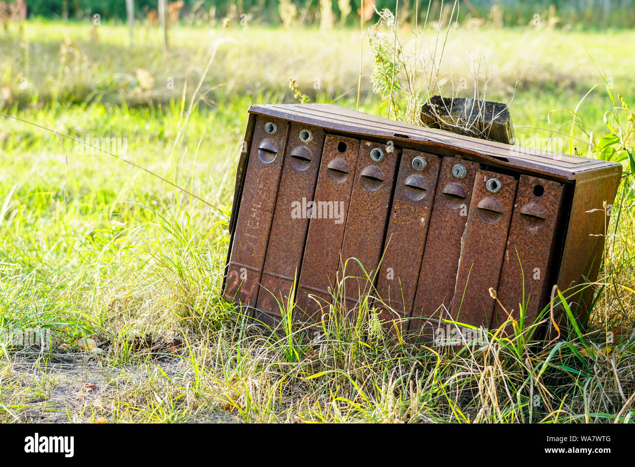 old rusty mailboxes in rural area on a green background Stock Photo - Alamy