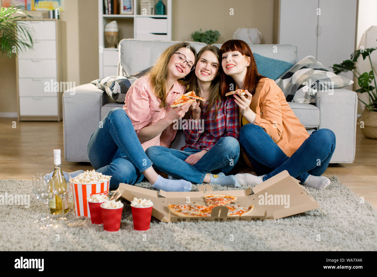 friendship, holidays, fast food and celebration concept - happy young ...