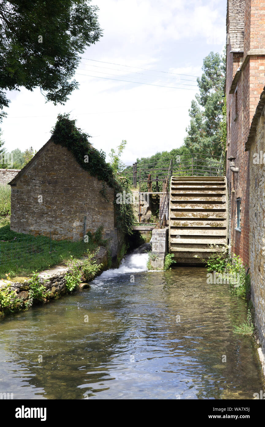 the old mill water wheel in Lower slaughter England Stock Photo - Alamy