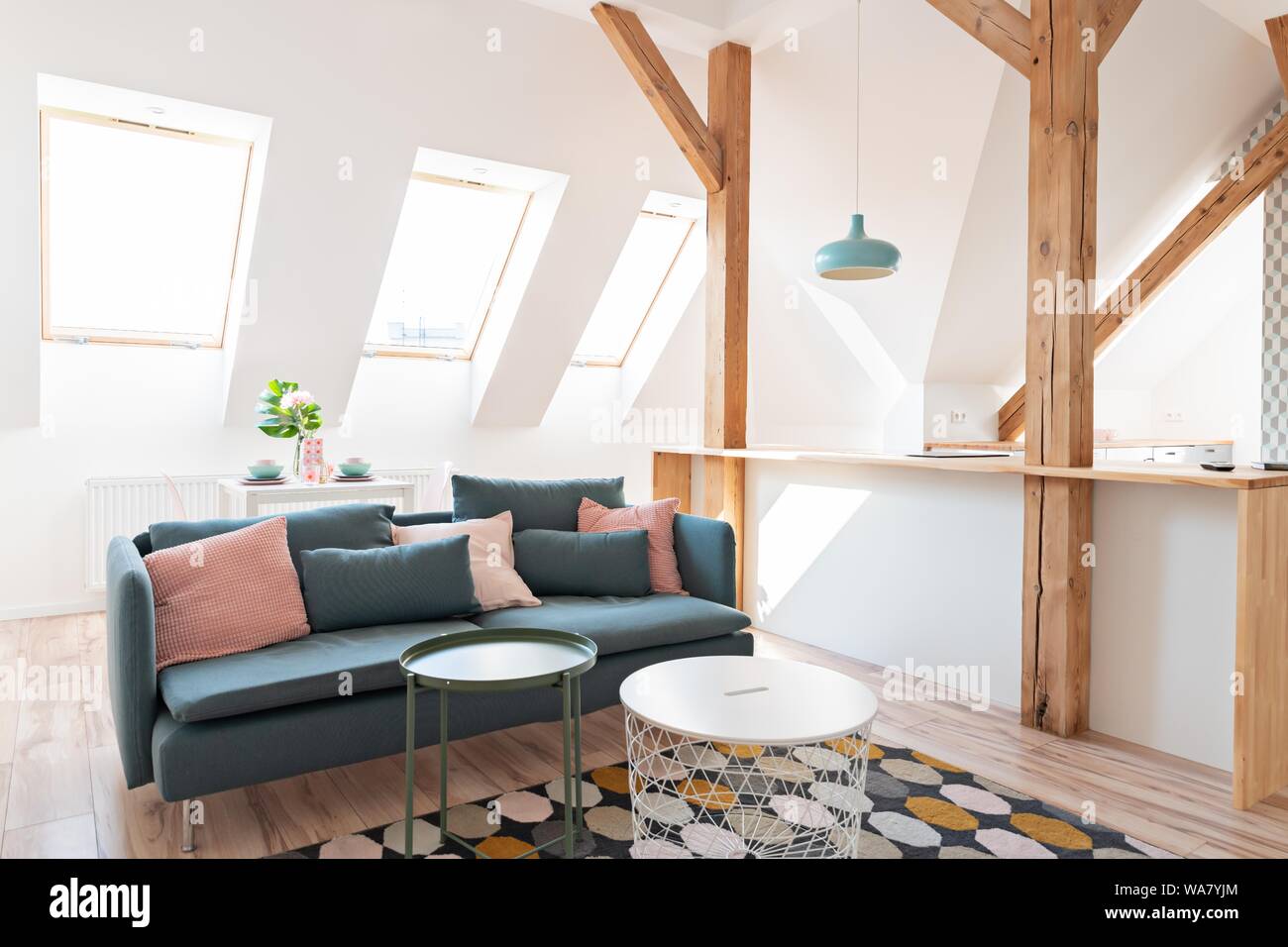 Modern bright living room with textile sofa Stock Photo - Alamy
