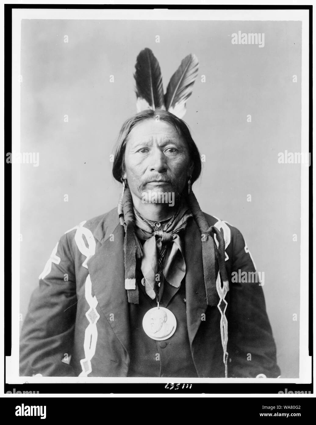 Buckskin Charlie, Ute, half-length portrait, facing front, with medal ...