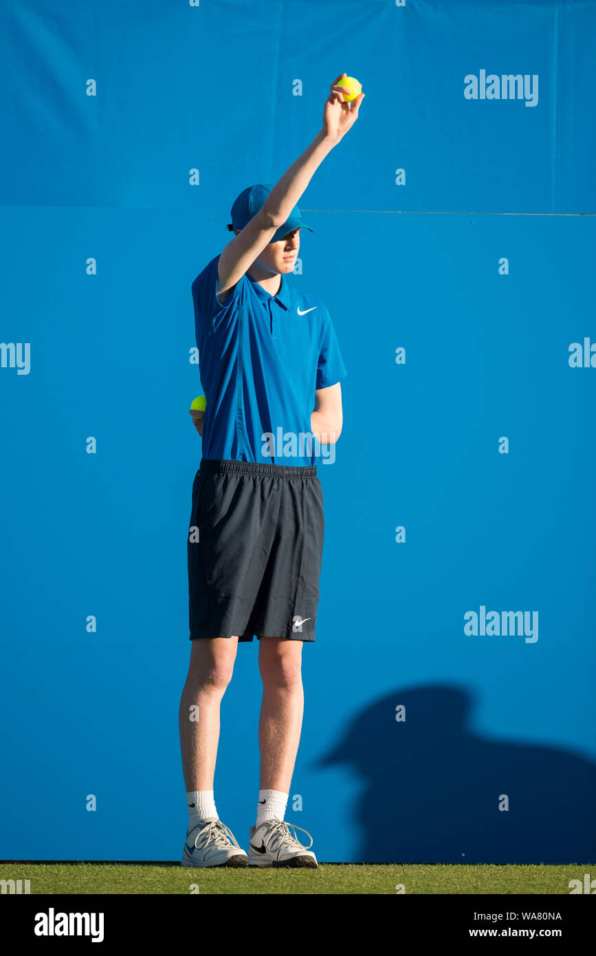 Ball boy offering tennis ball to player at Aegon International 2015 ...