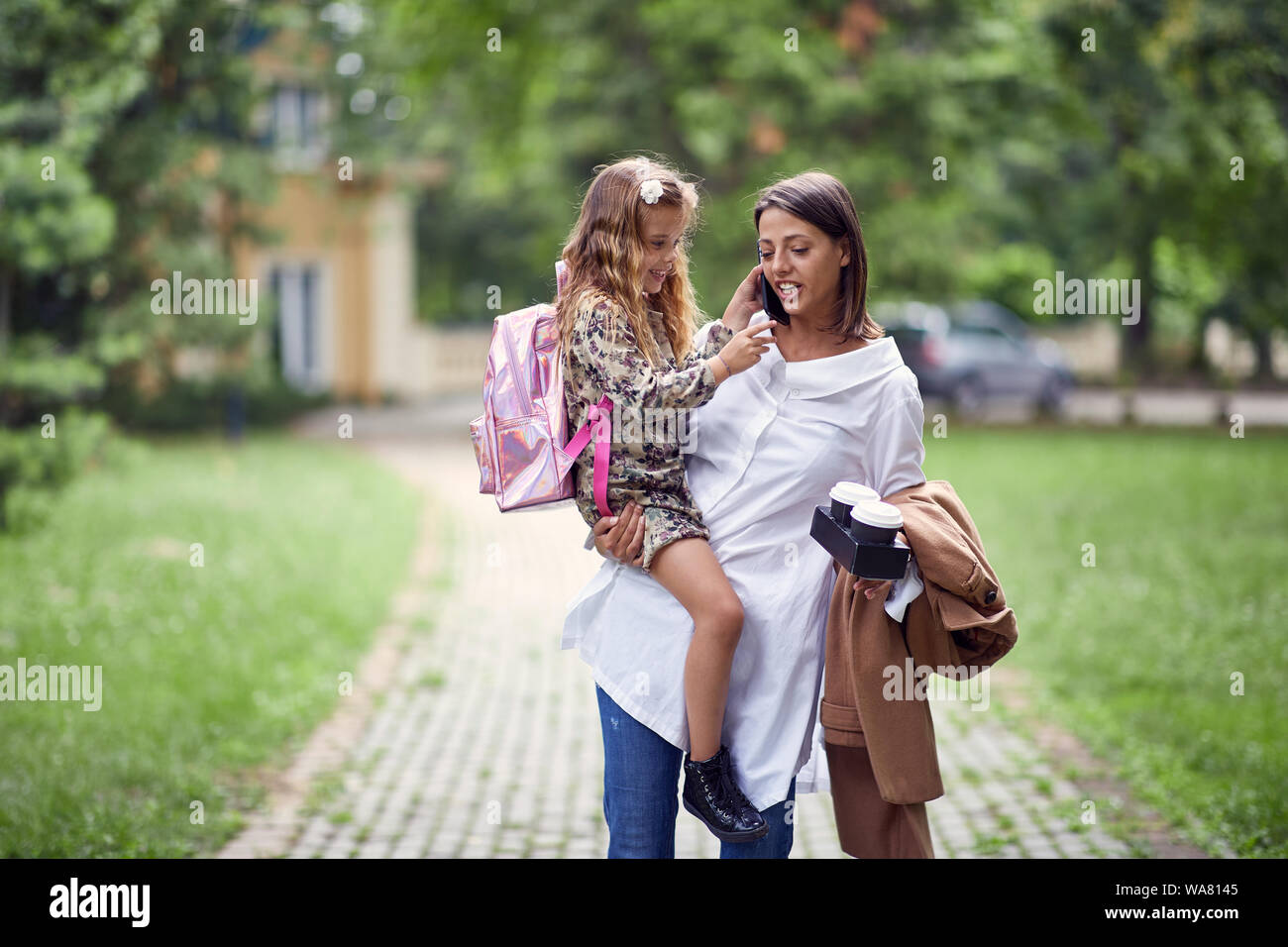 Child walking to school with parent hi-res stock photography and images ...