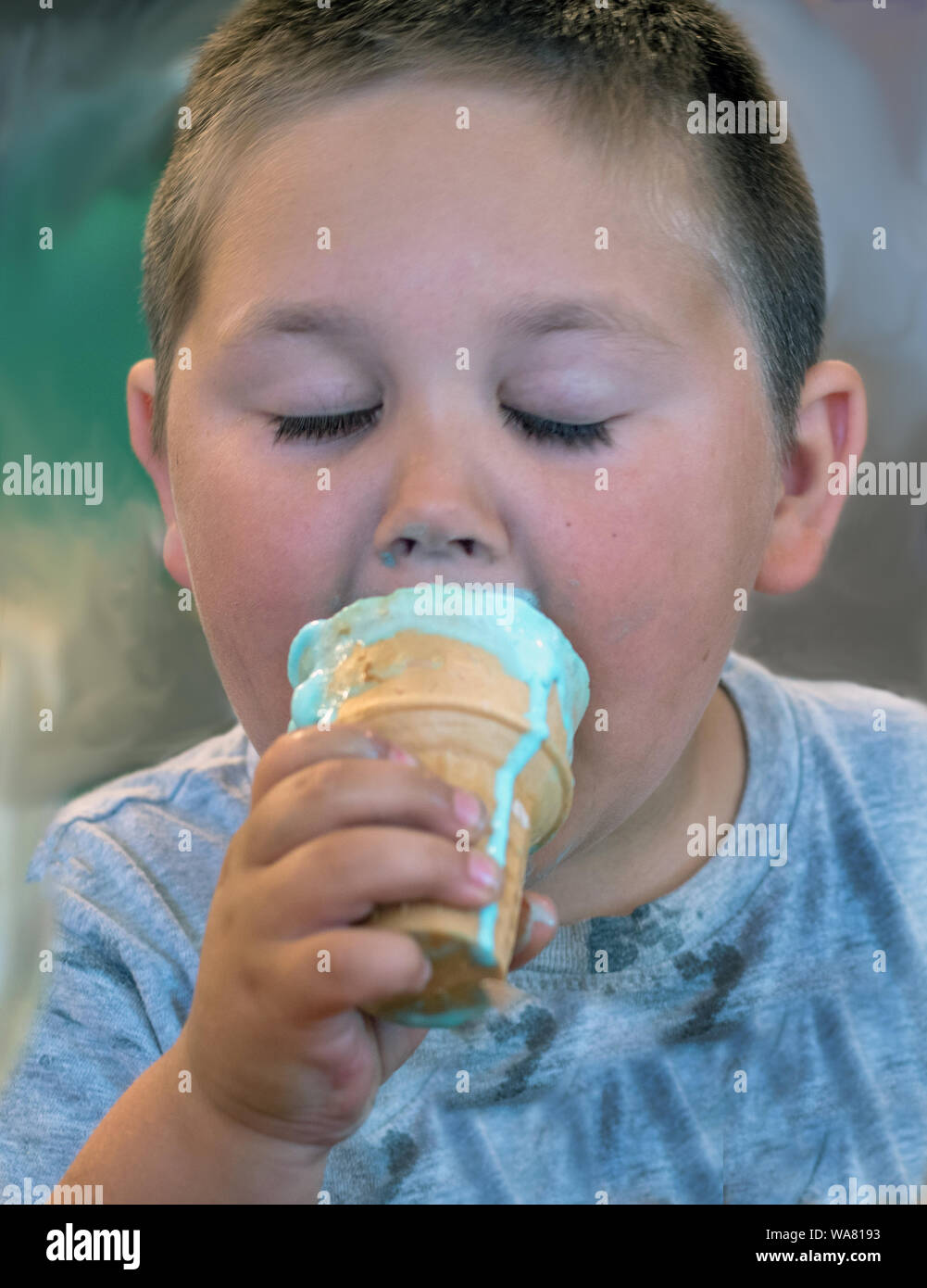 little boy really enjoys his ice cream cone Stock Photo - Alamy