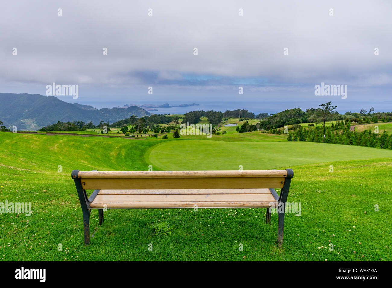 Park bench outdoor landscape. Wooden bench in golf course landscape ...