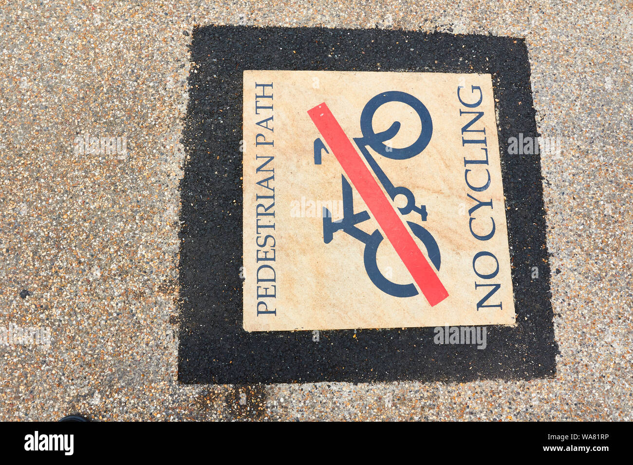 No bicycle riding or skateboarding on sidewalk pavement sign hi-res ...