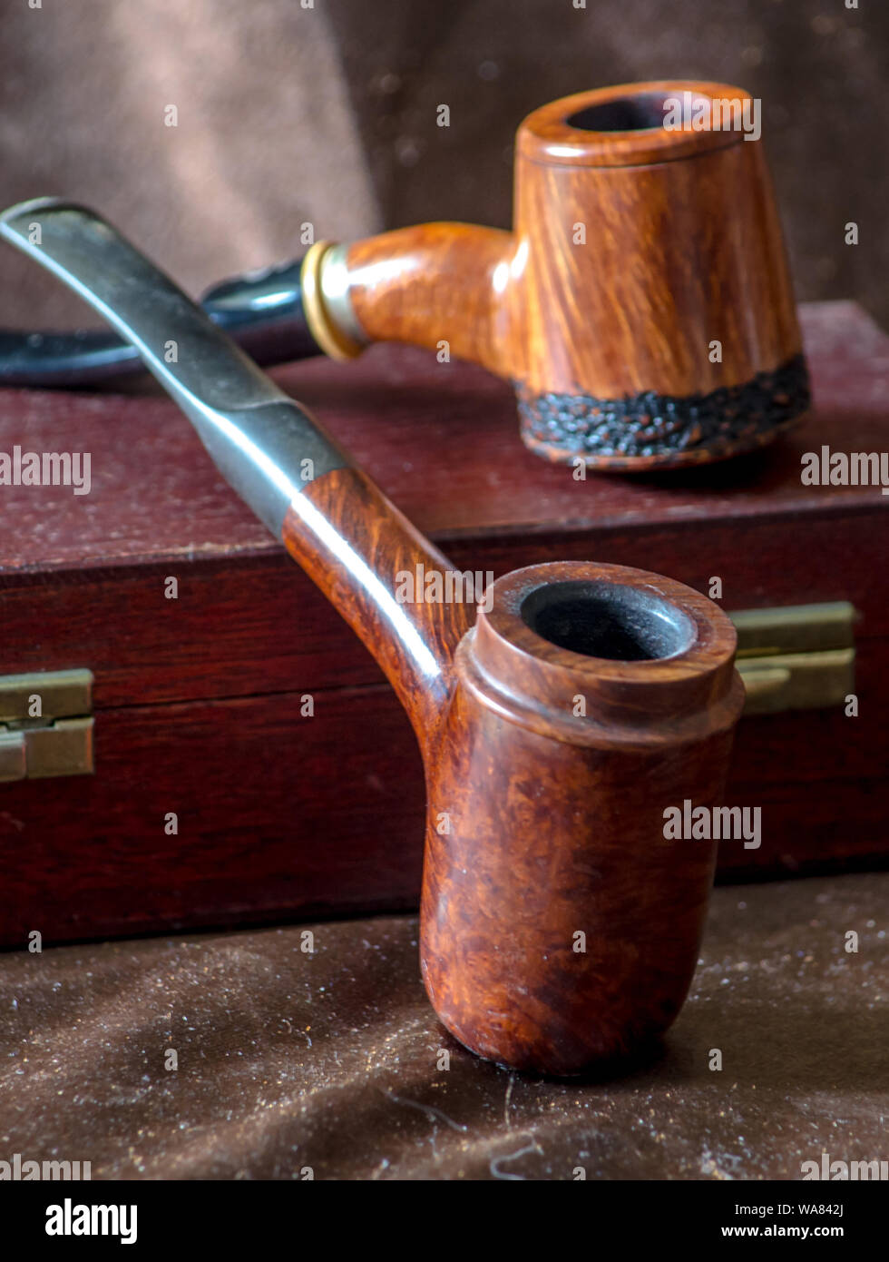 Captain morgan pipe and a partially rusticated pipe with wood pipe box ...
