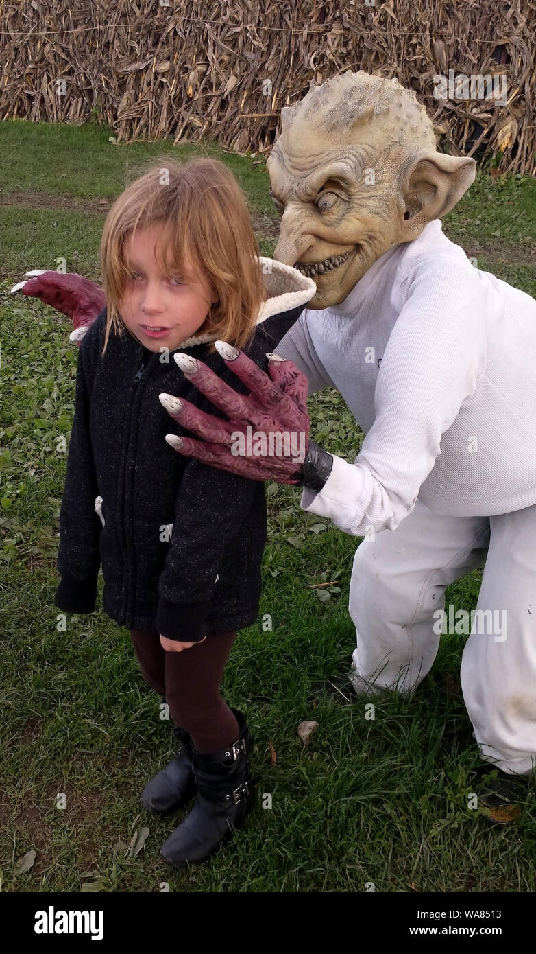 little girl is afraid to move as she senses something scary behind her ...