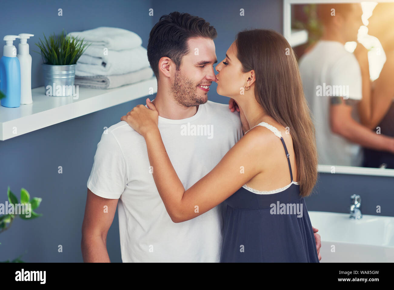 Couple hugging in bathroom hi-res stock photography and images - Alamy