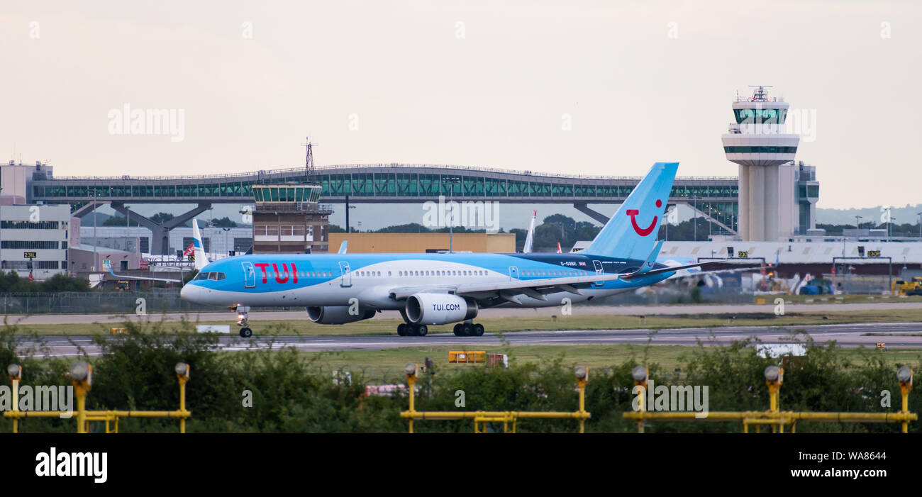A Tui Airways Boeing 757-200 plane turns off the runway in front of the ...