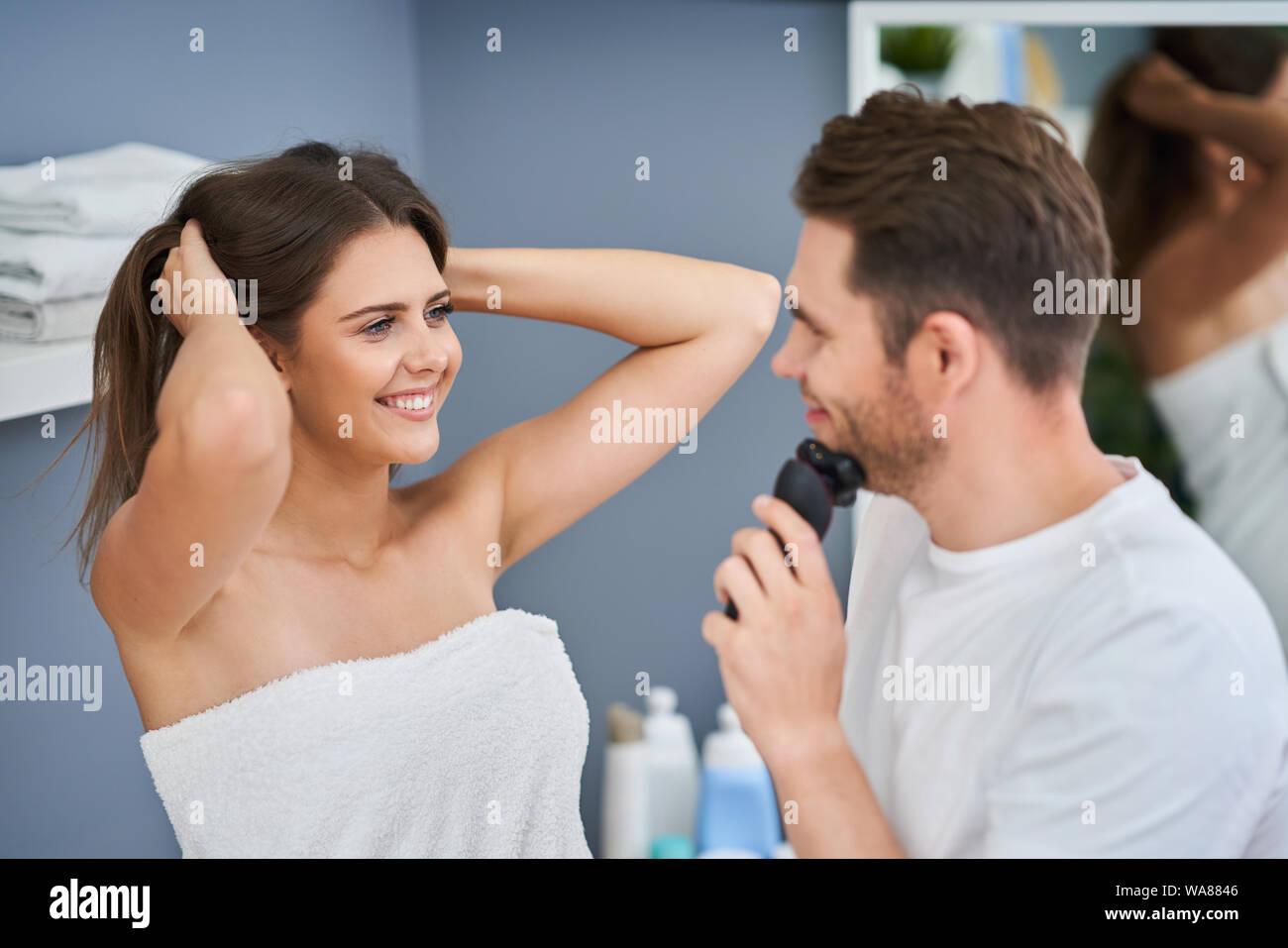 Portrait of happy young couple in the bathroom Stock Photo - Alamy