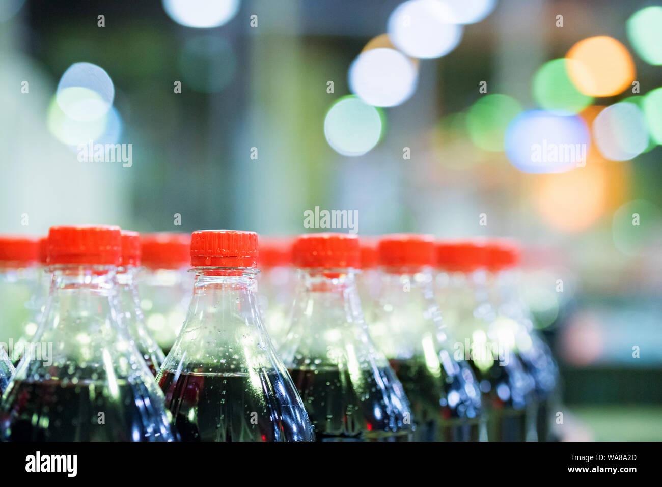 Close up bottle line at soft drinks factory Stock Photo - Alamy