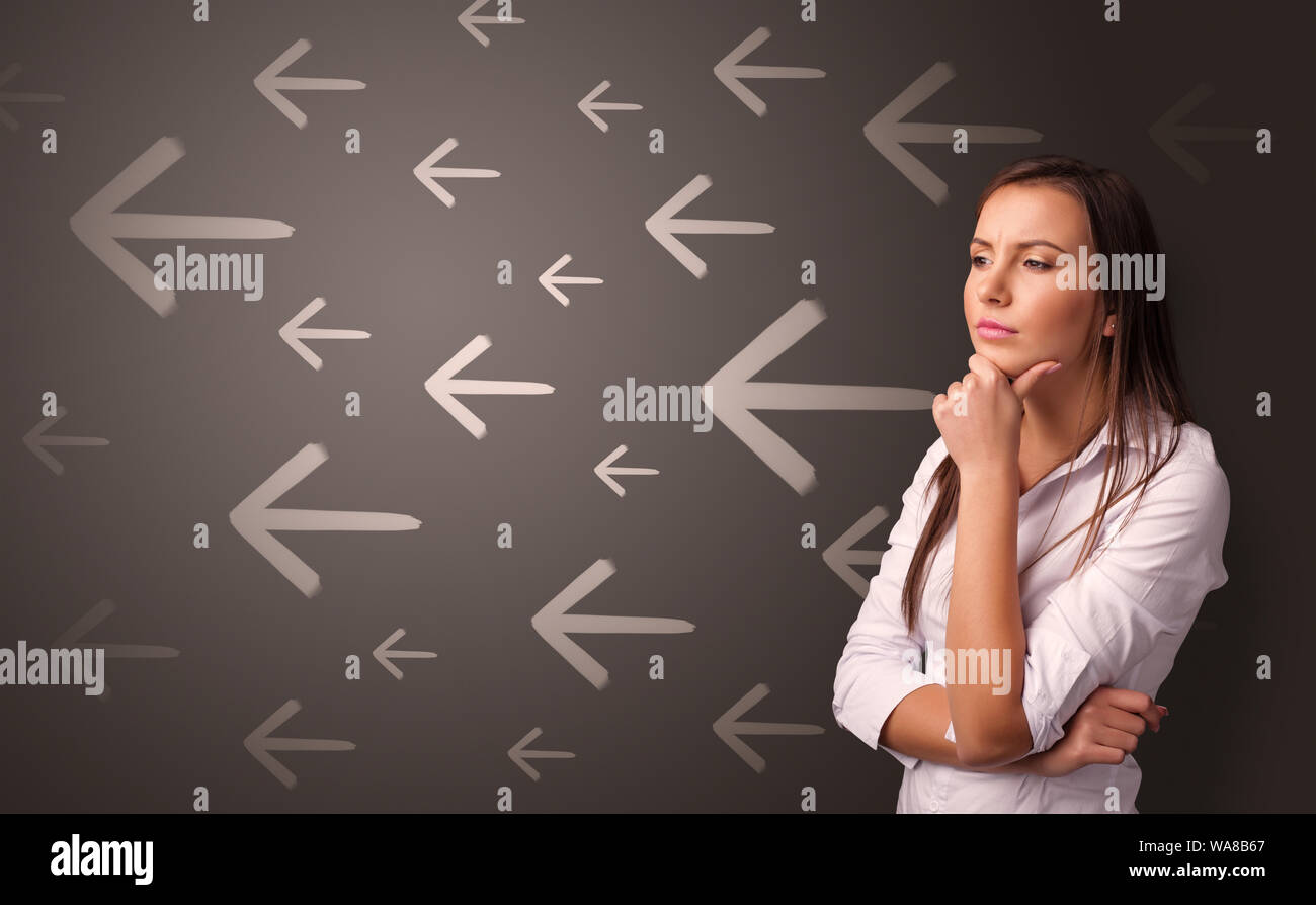 Young person thinking with direction concept background Stock Photo - Alamy