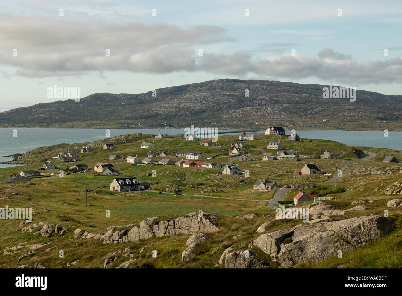 The isle of Eriskay with South Uist and causeway in the background ...
