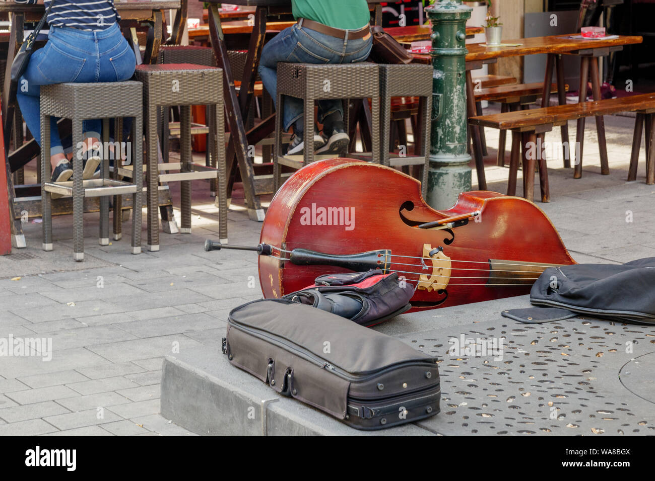 Cello, violin or bass, string musical instrument, of street performer ...