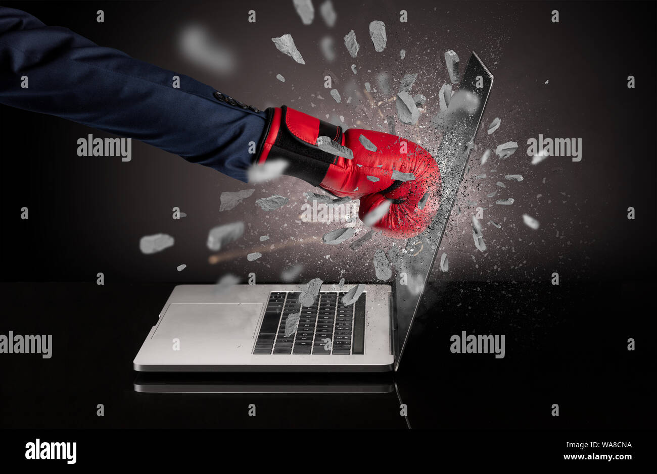 Strong male hand breaks laptop screen Stock Photo - Alamy