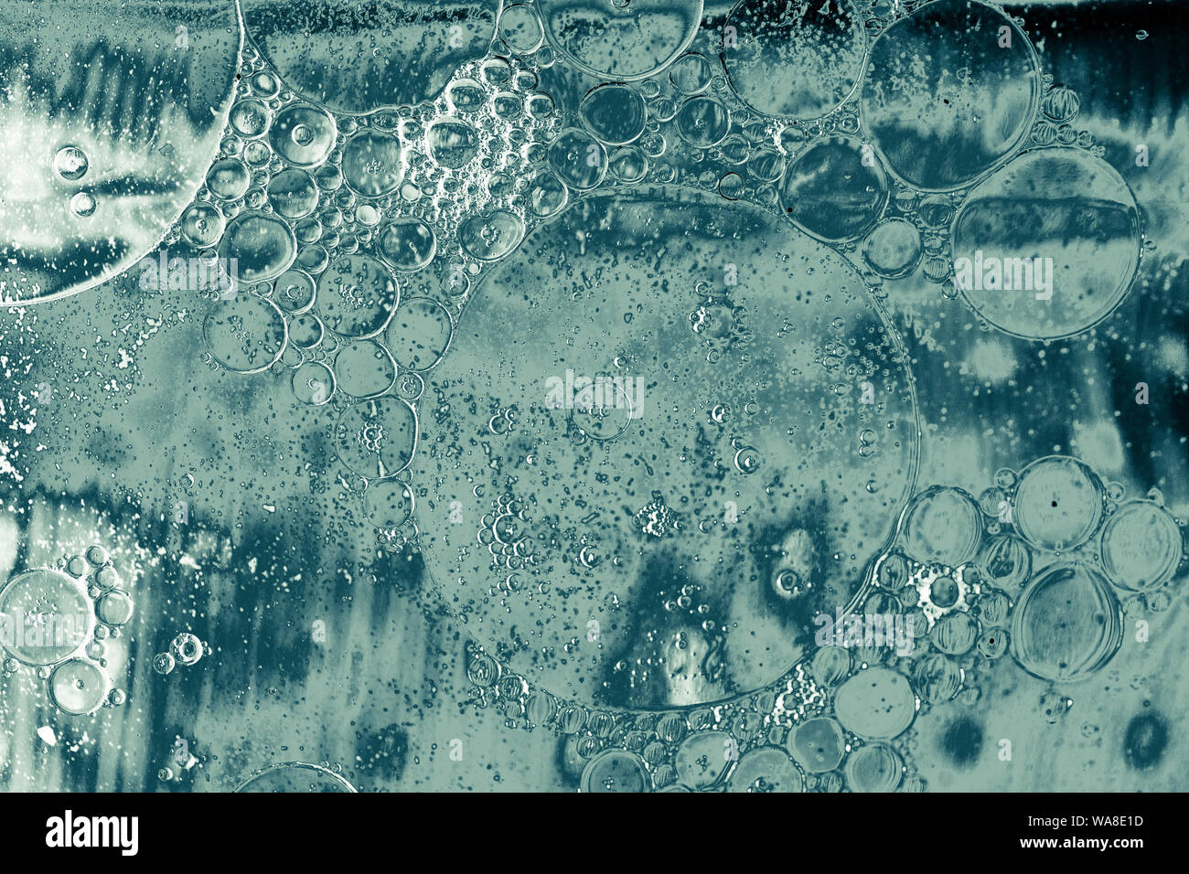 Oil bubbles inside water base form patterns Stock Photo - Alamy