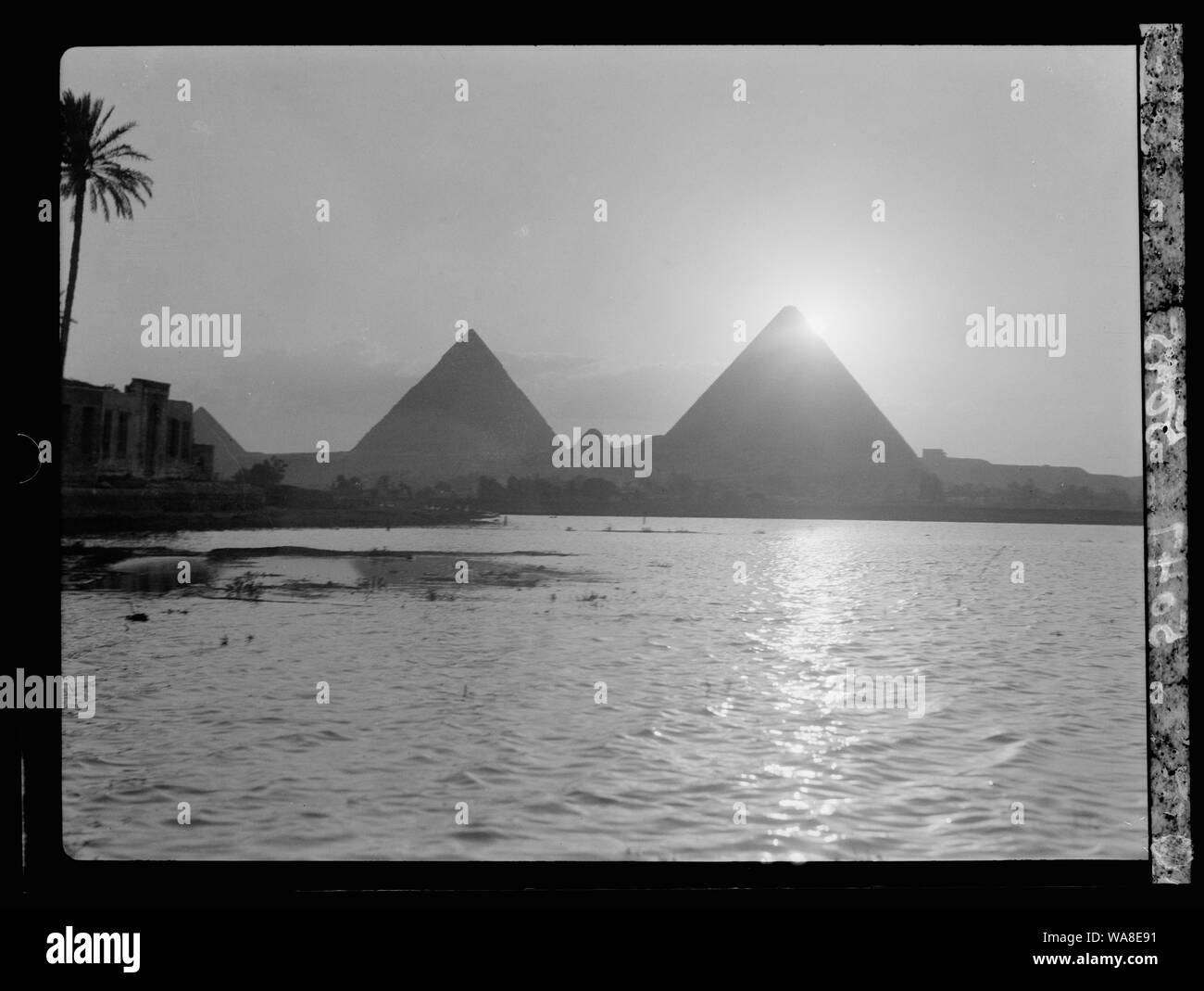 Cairo and district, Egypt. Silhouette of the pyramids. Sinking sun ...