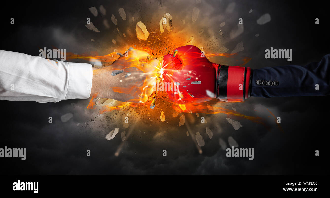 Two hands fighting and breaking a rock into small pieces Stock Photo ...