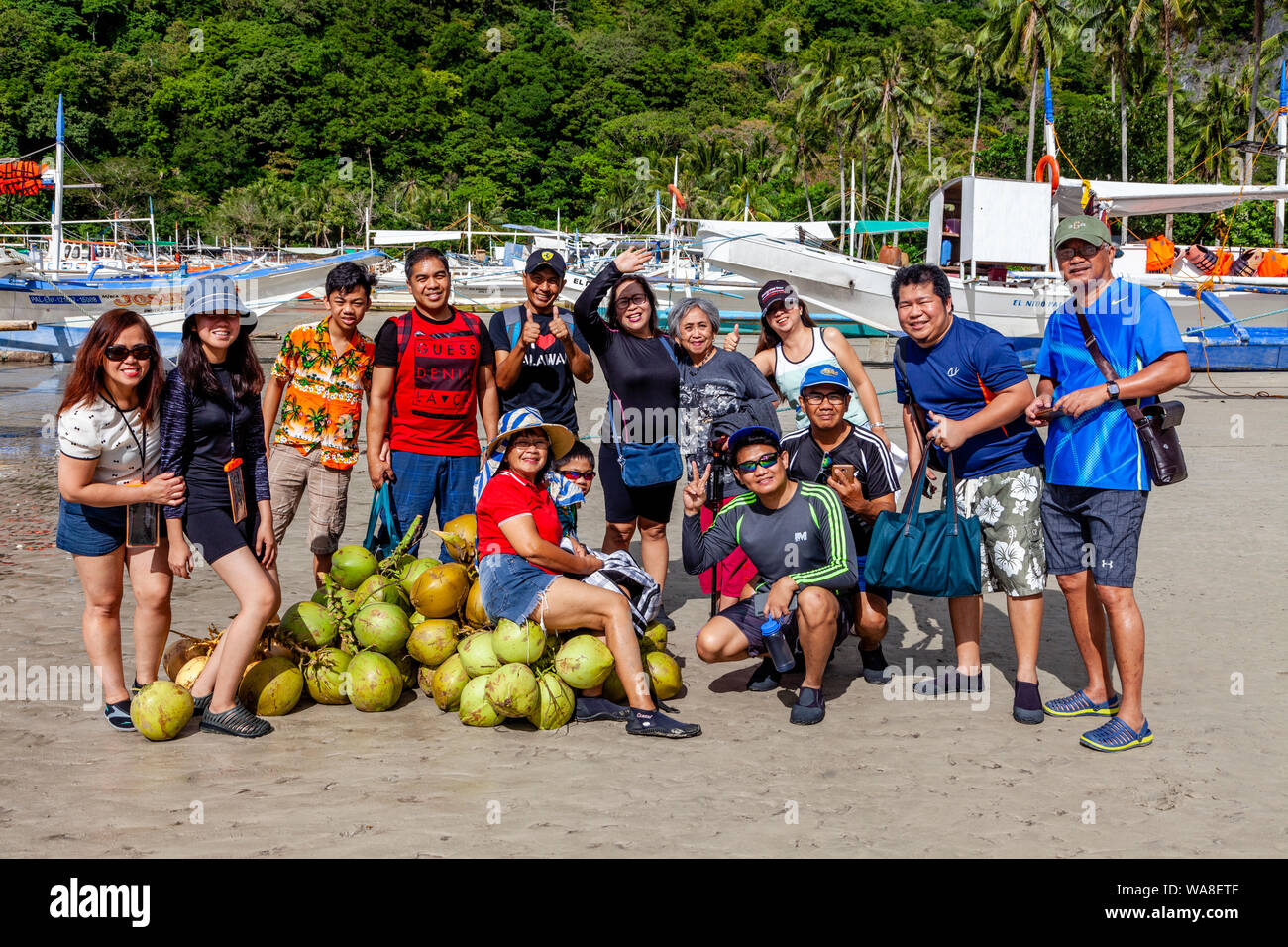A Group Of Filipino Tourists Pose For A Photo, Corong Corong Beach, El ...